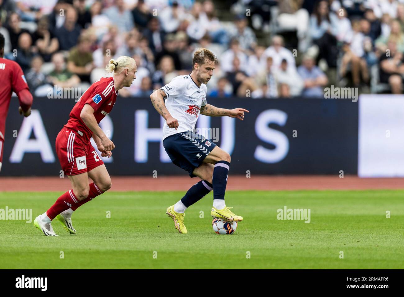 Aarhus, Denmark. 27th Aug, 2023. Felix Beijmo (2) of AGF and Kolbeinn ...