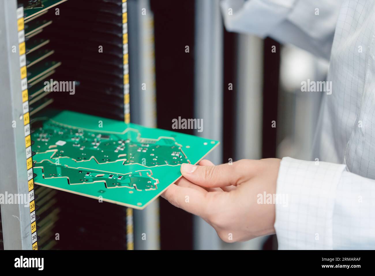 electrical engineer at assembly line inspecting PCB boards Stock Photo ...