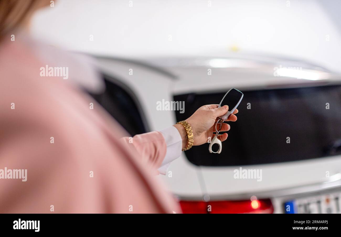 woman using fob as key to open her class car Stock Photo - Alamy