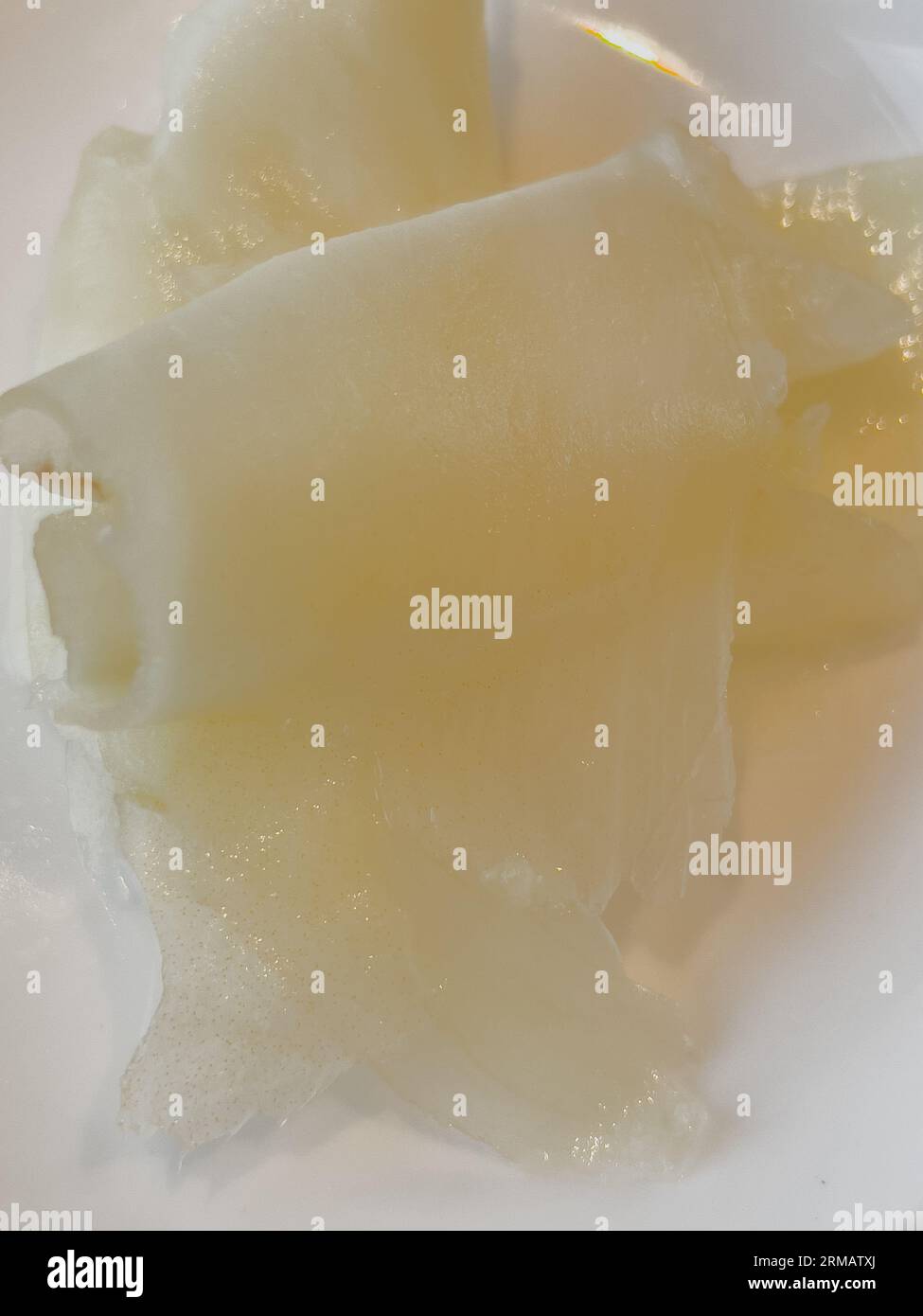 Gari, pickled ginger in a white bowl. Thinly sliced ginger, marinated ...