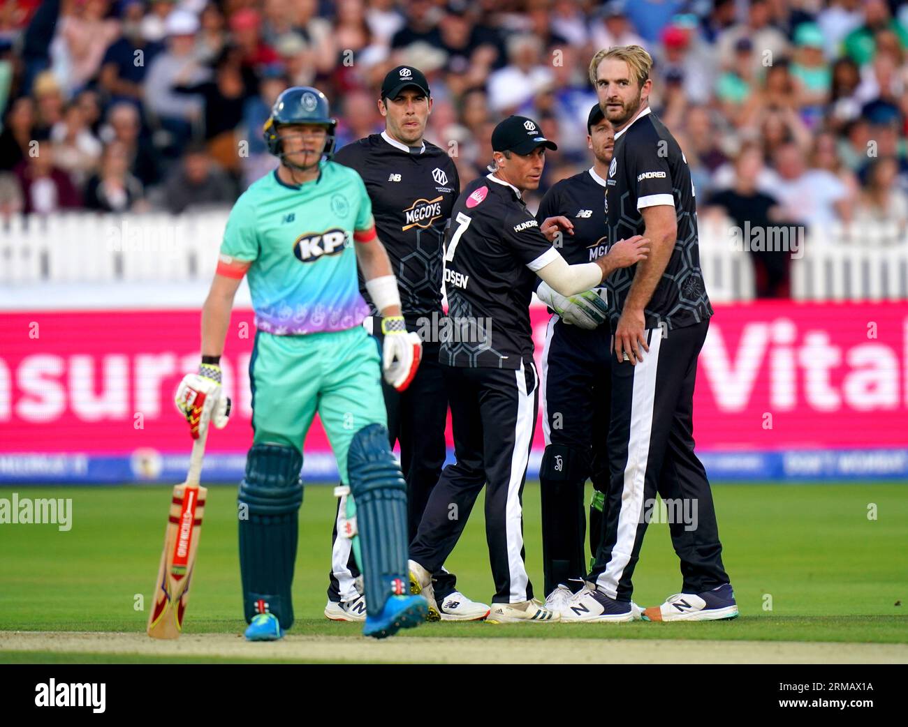 Manchester Originals players celebrate after taking the wicket of Oval ...