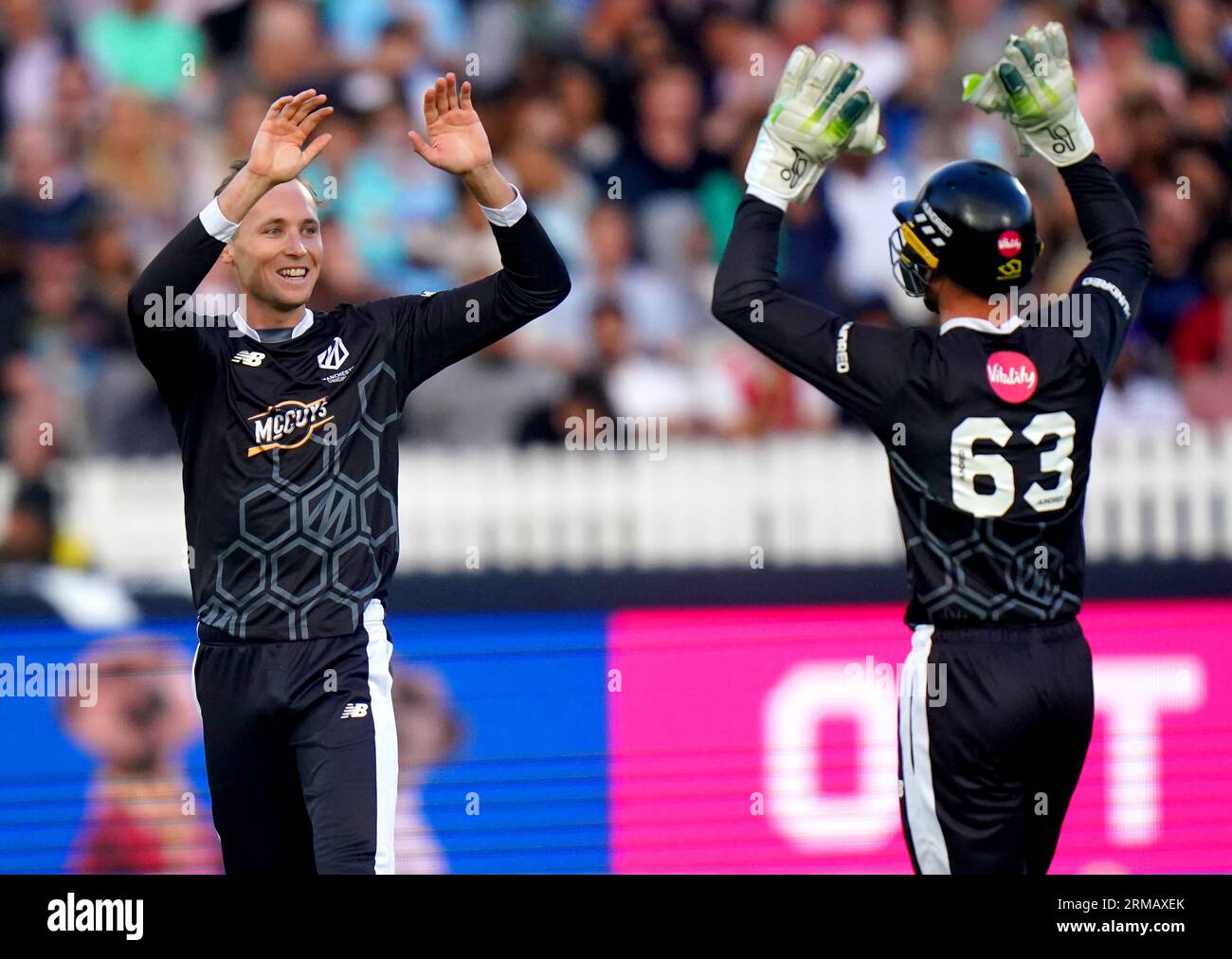 Manchester Originals' Tom Hartley (left) celebrates after taking the ...