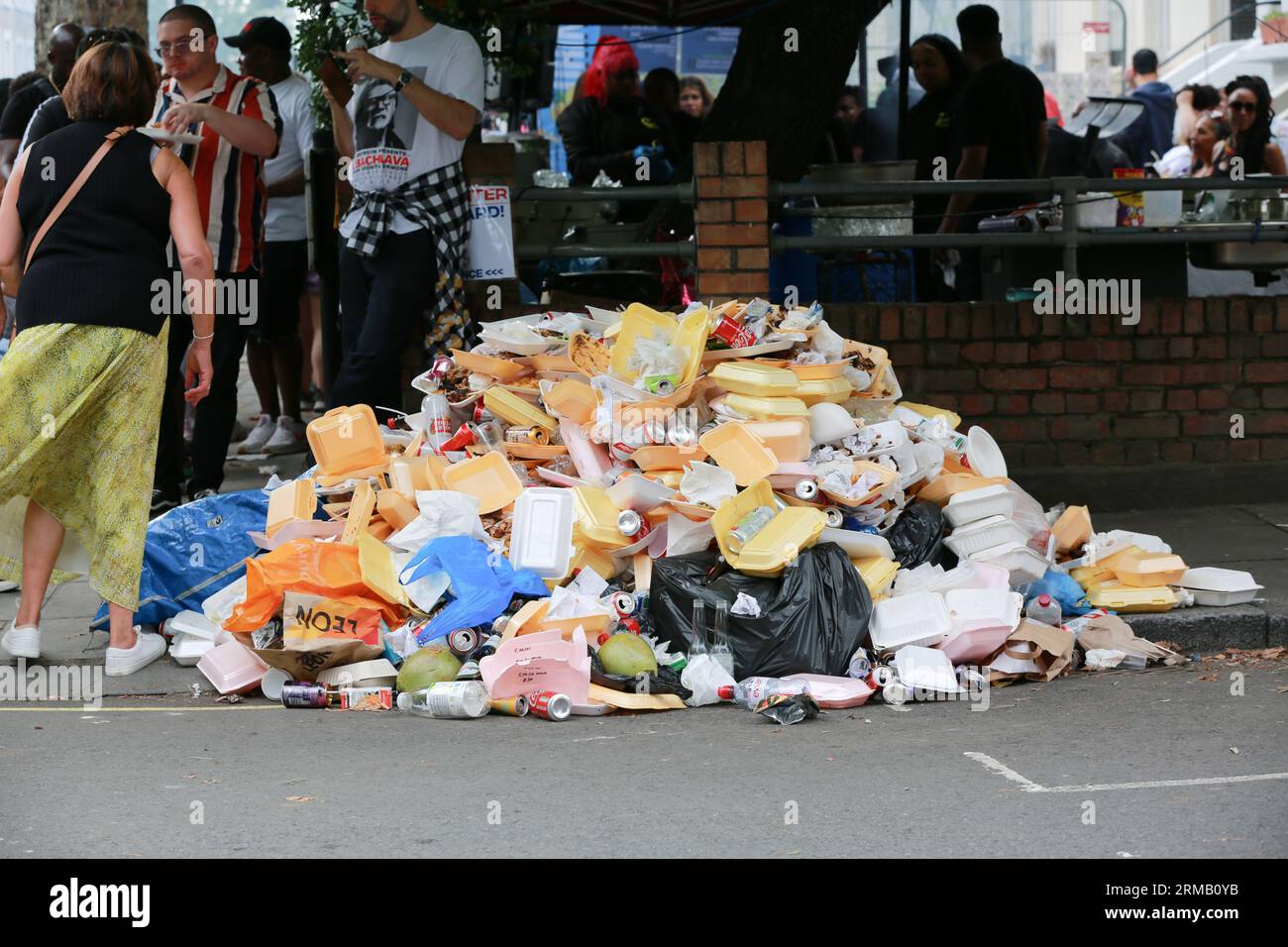 London, UK. 27 August 2023. Discarded food containers are piled up on ...
