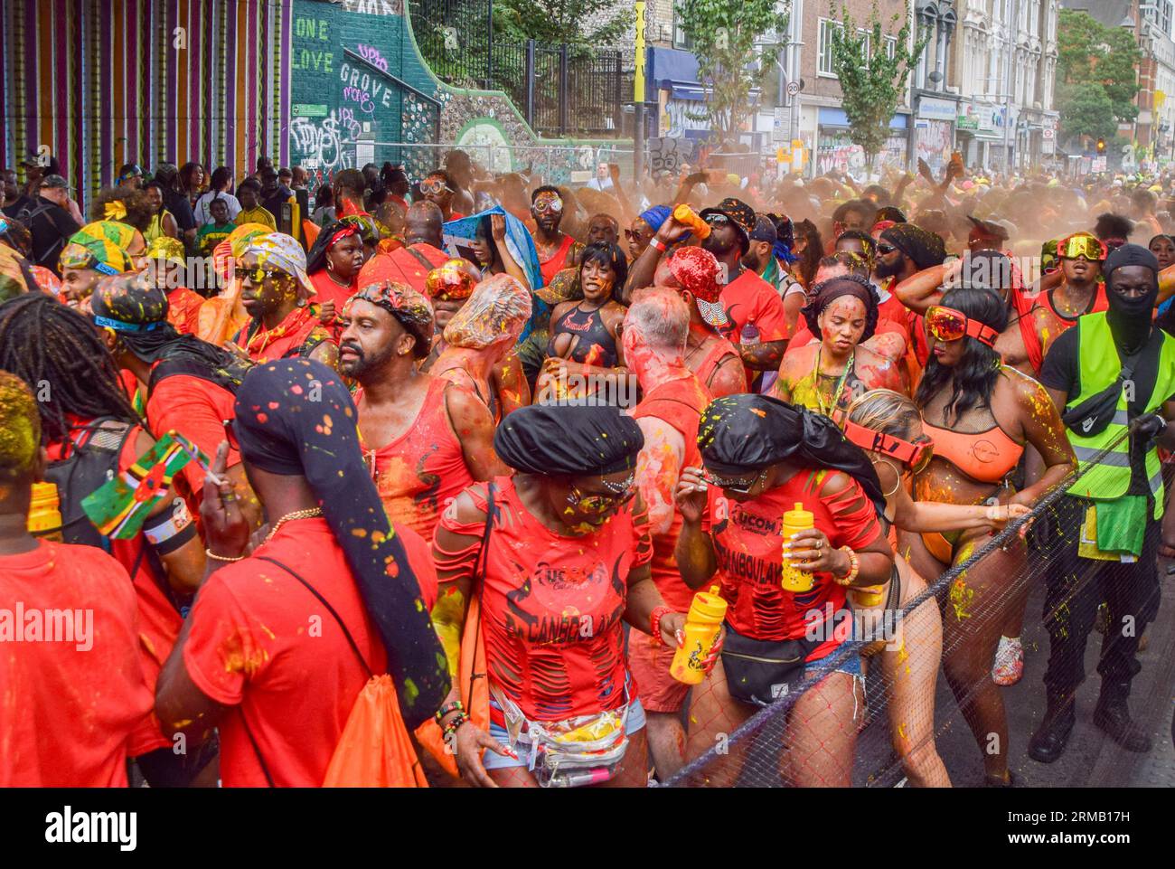 London, UK. 27th August 2023. Parade participants spray paint and ...