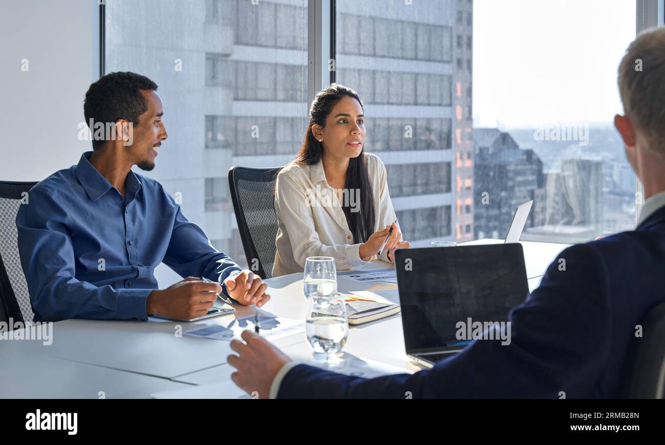 Company diverse people sitting table hi-res stock photography and ...