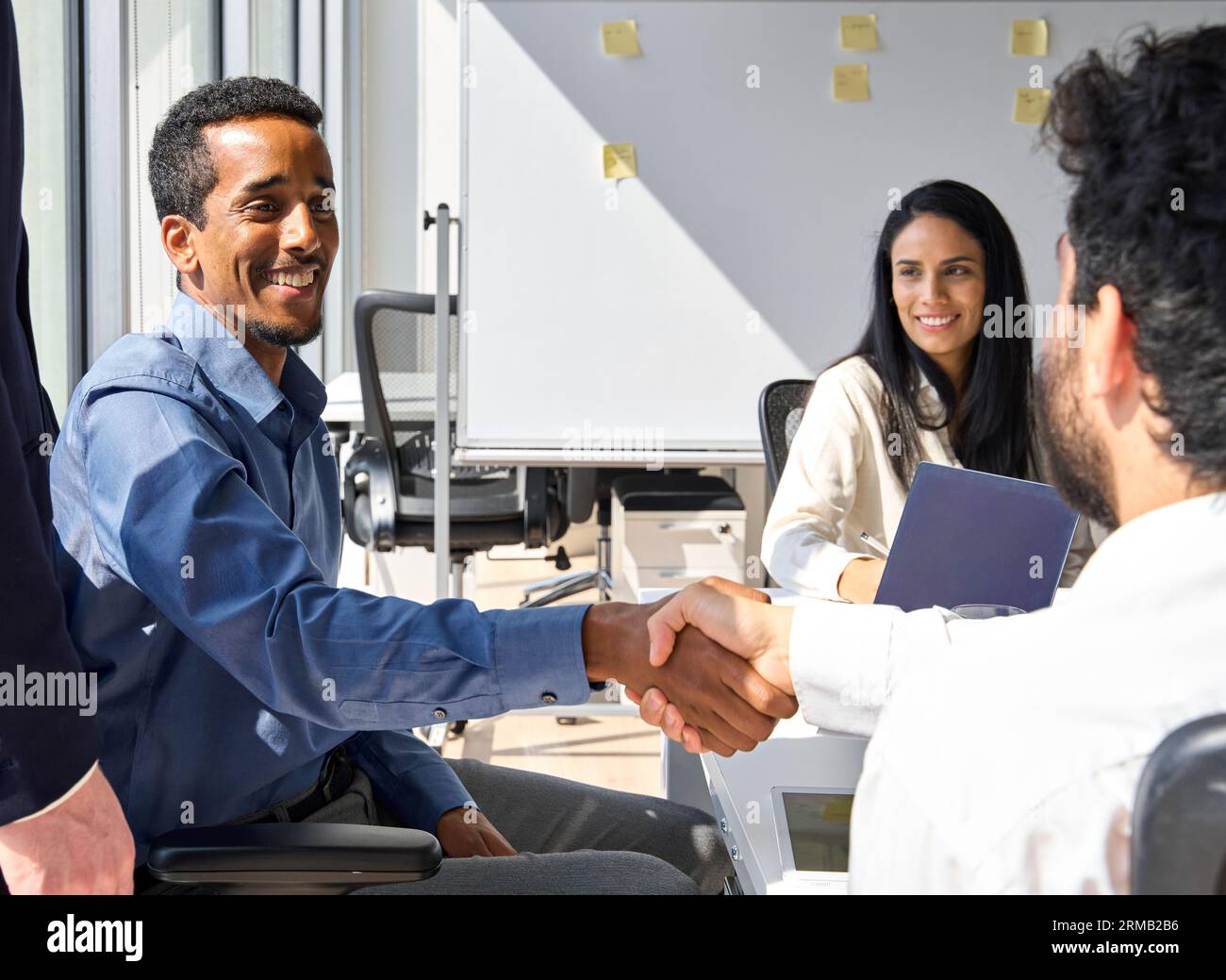 Diverse business people shake hi-res stock photography and images - Alamy