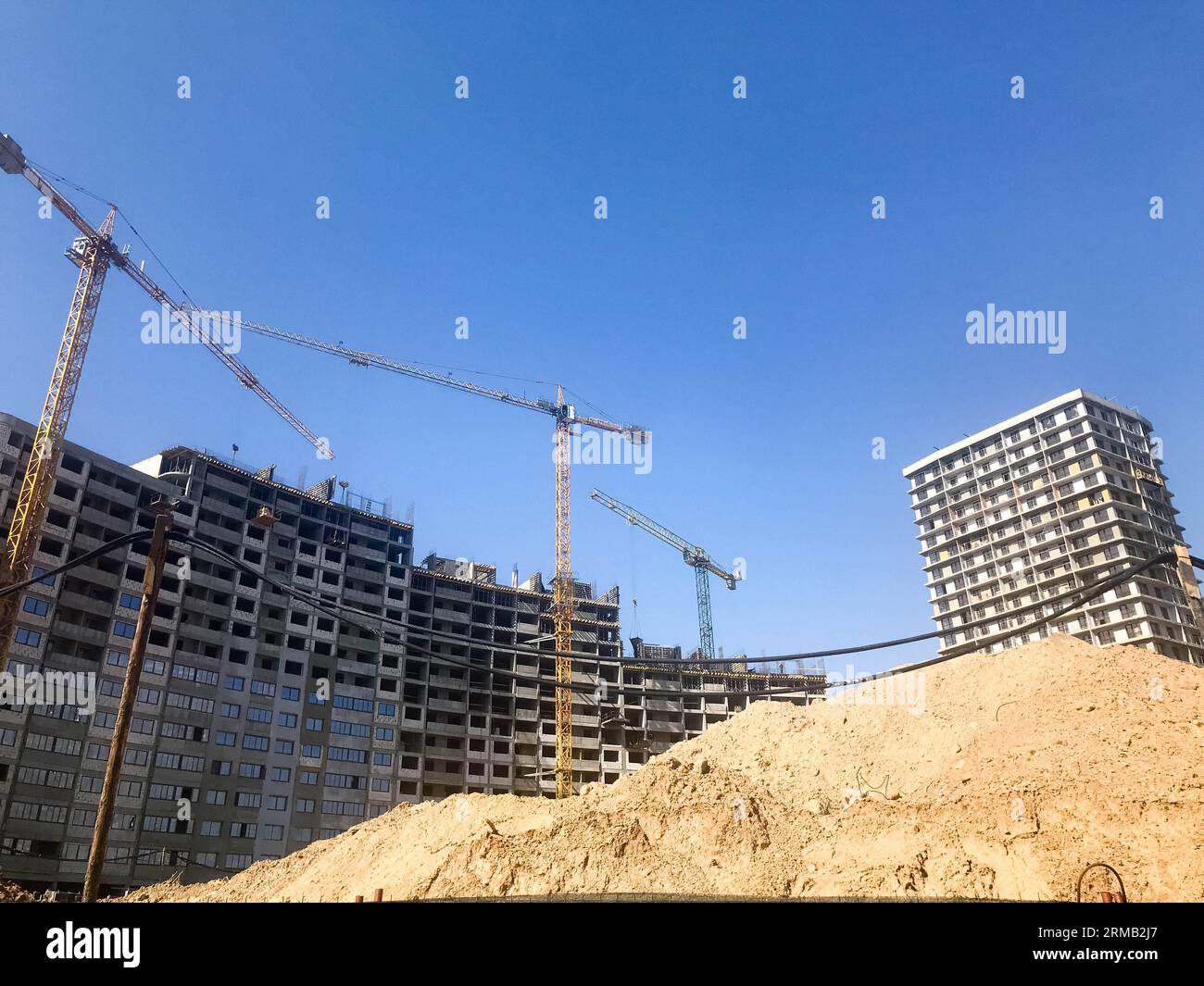 Building with the help of construction cranes of high reinforced ...