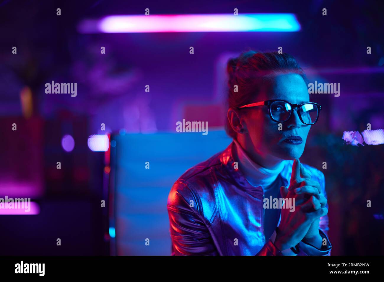 Neon metaverse futuristic concept. Portrait of pensive stylish business ...