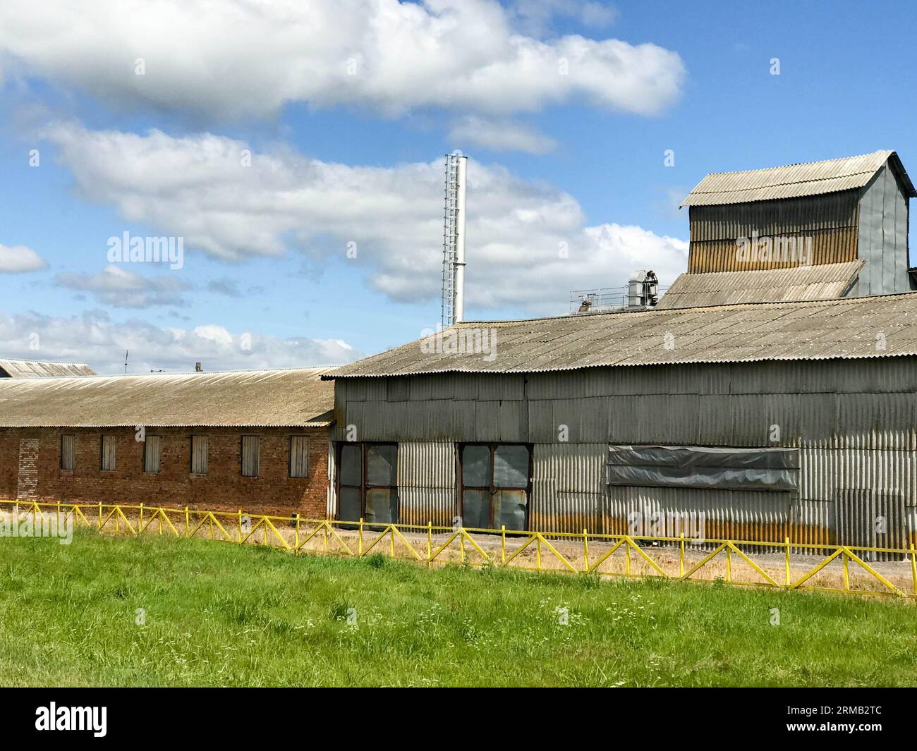 Large agricultural agricultural farm building with equipment, houses ...