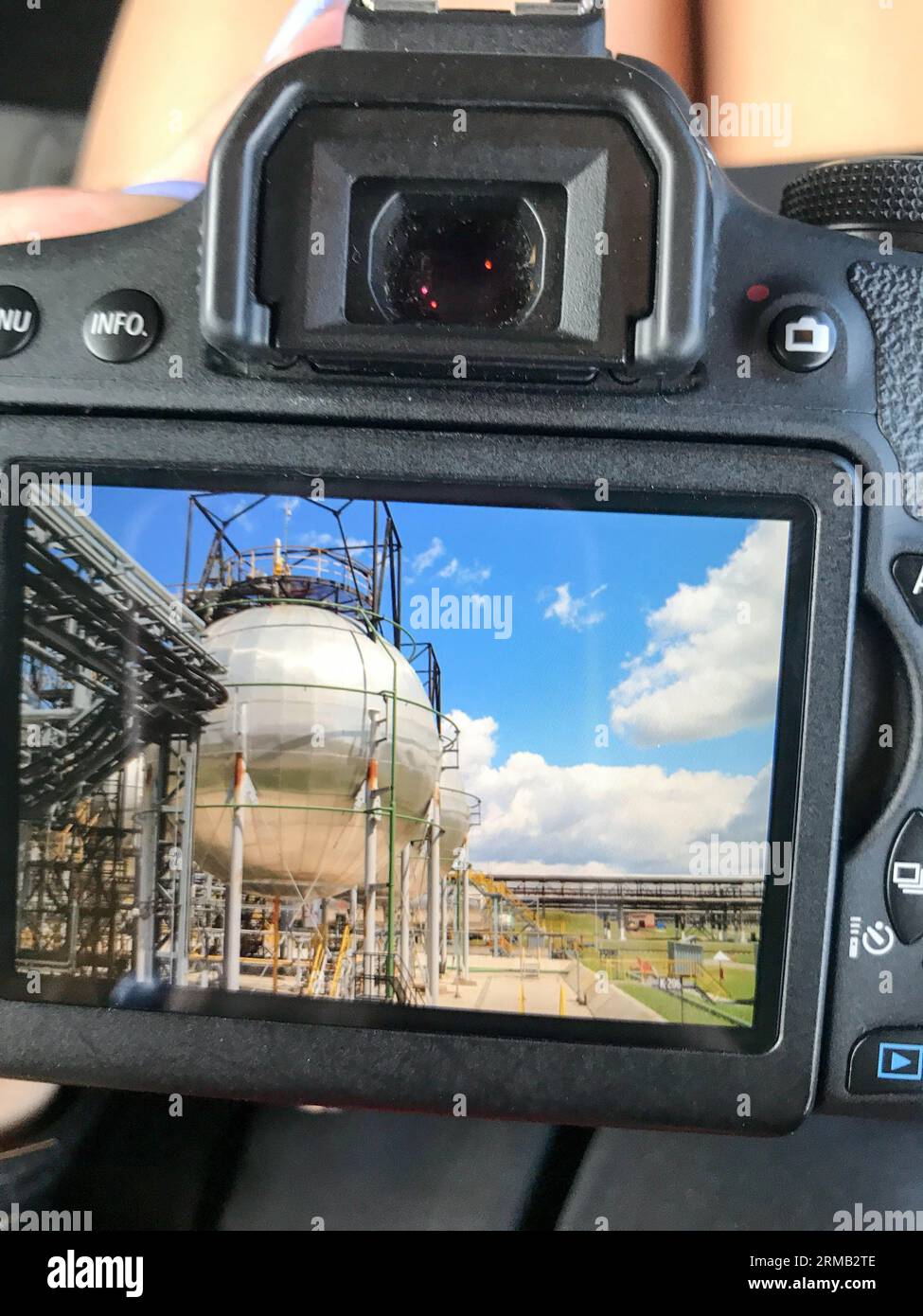 The view of the camera with the photograph is a large round shiny ...