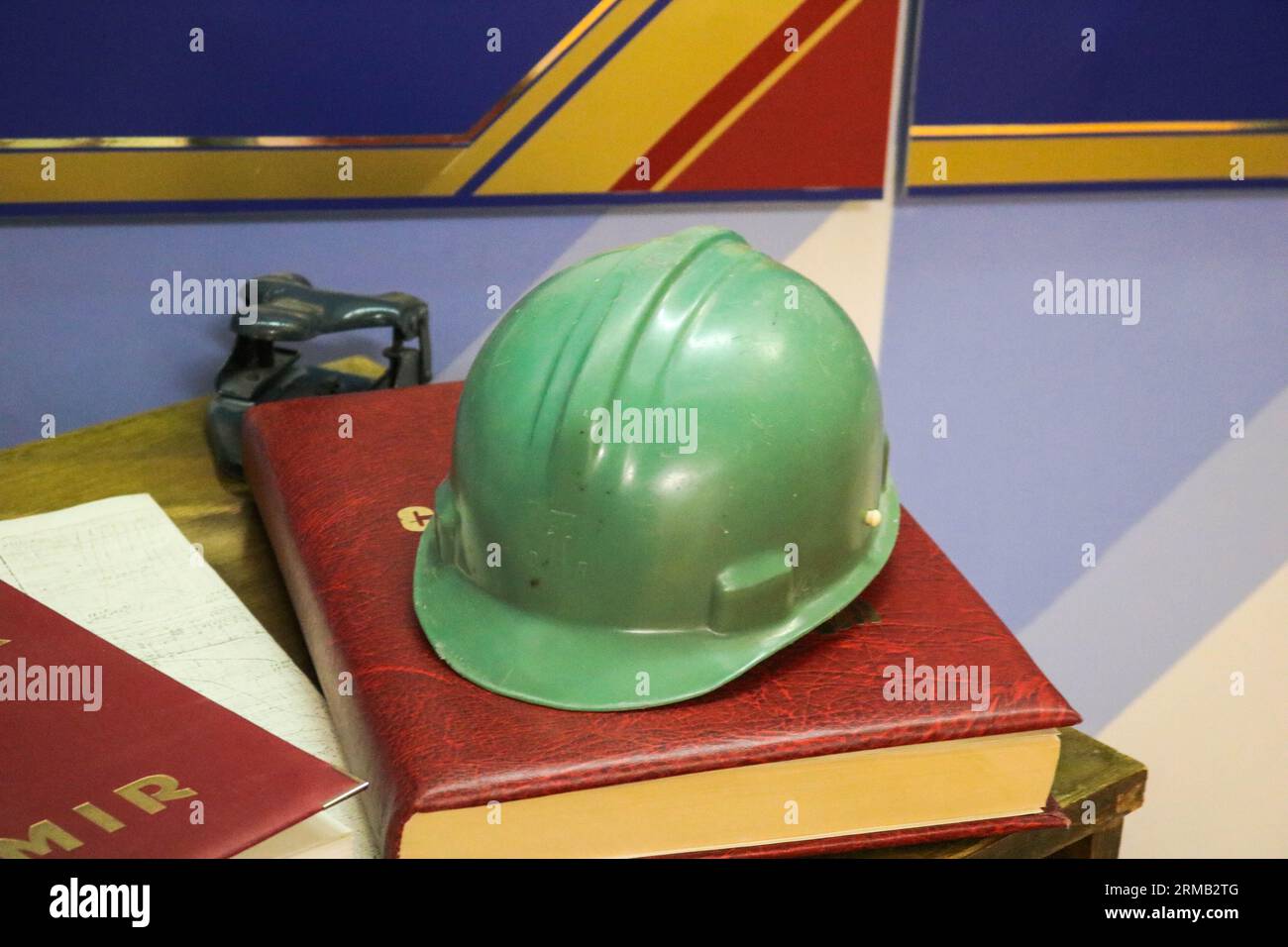 Green plastic safety helmet for the worker. Protective helmet to ...