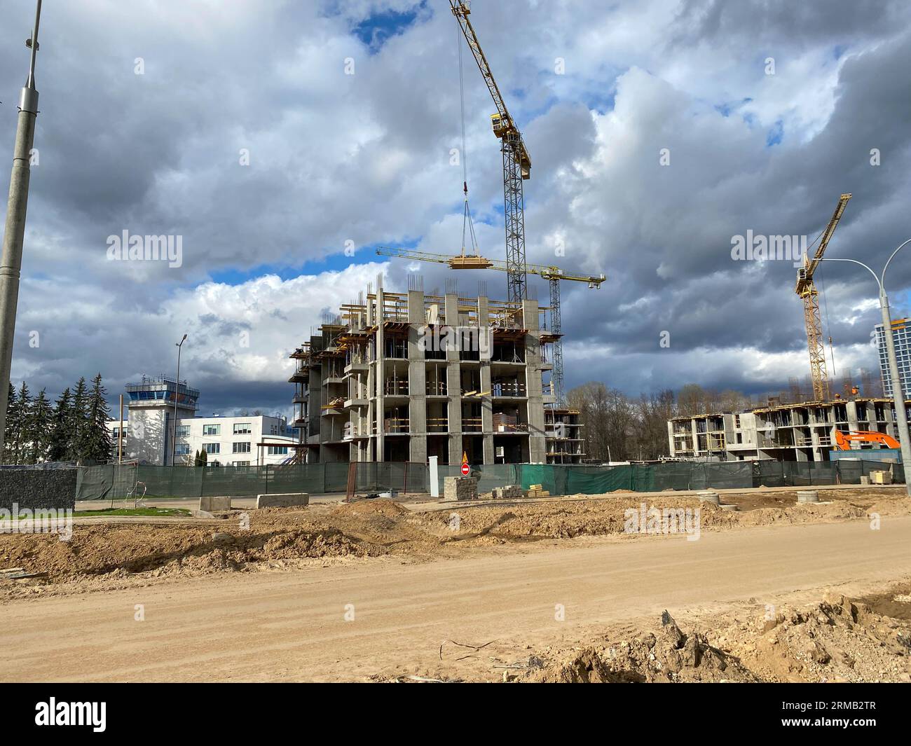 A large, high unfinished new building that is being built with the help ...