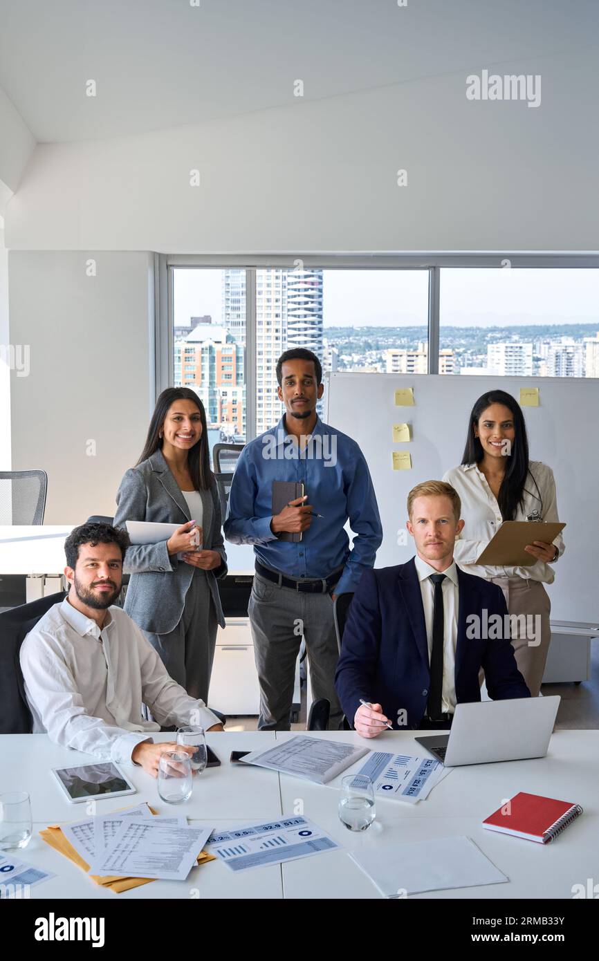 Professional diverse team business people in office boardroom. Vertical portrait Stock Photo - Alamy