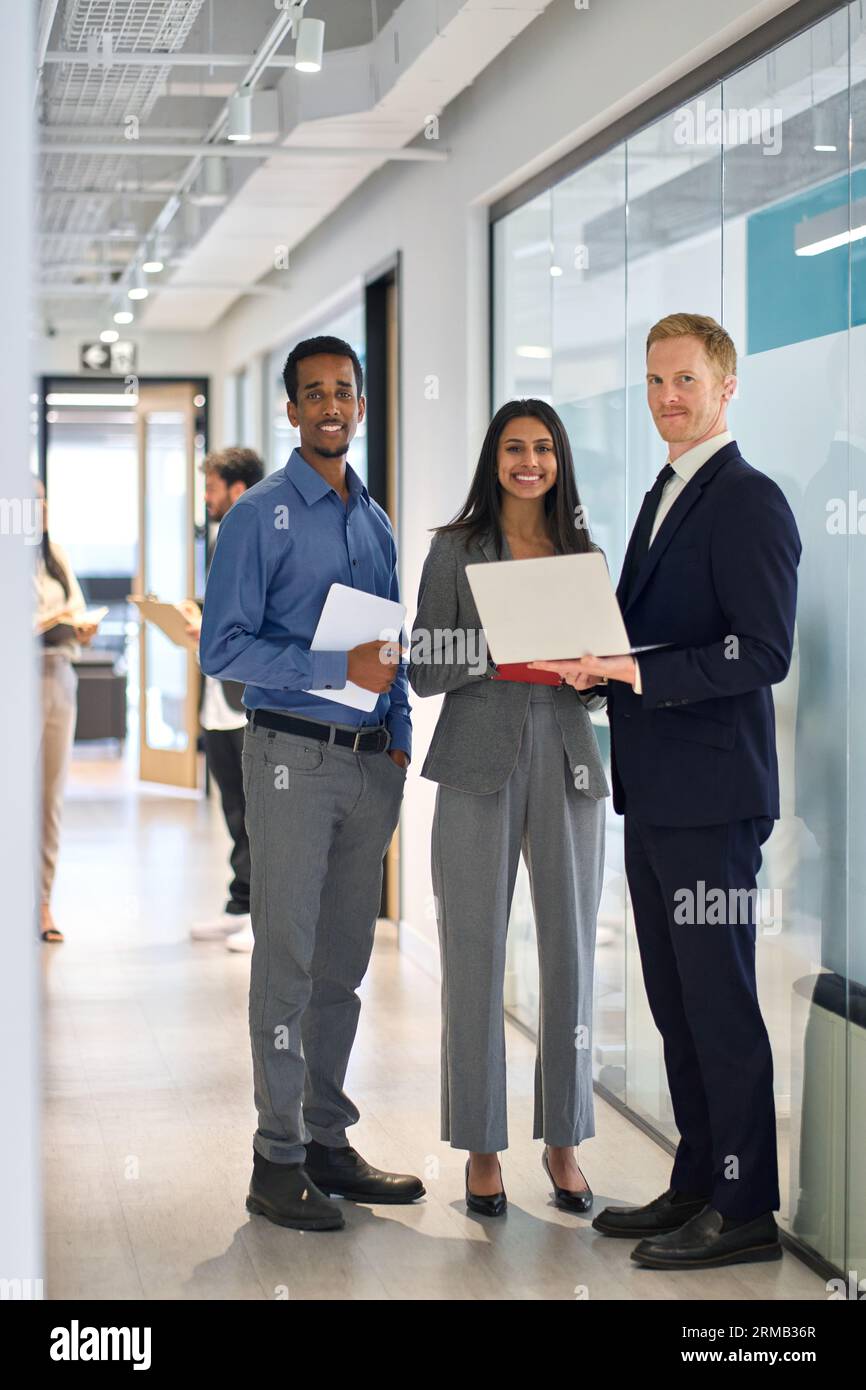 Professional diverse team young business people standing in office ...