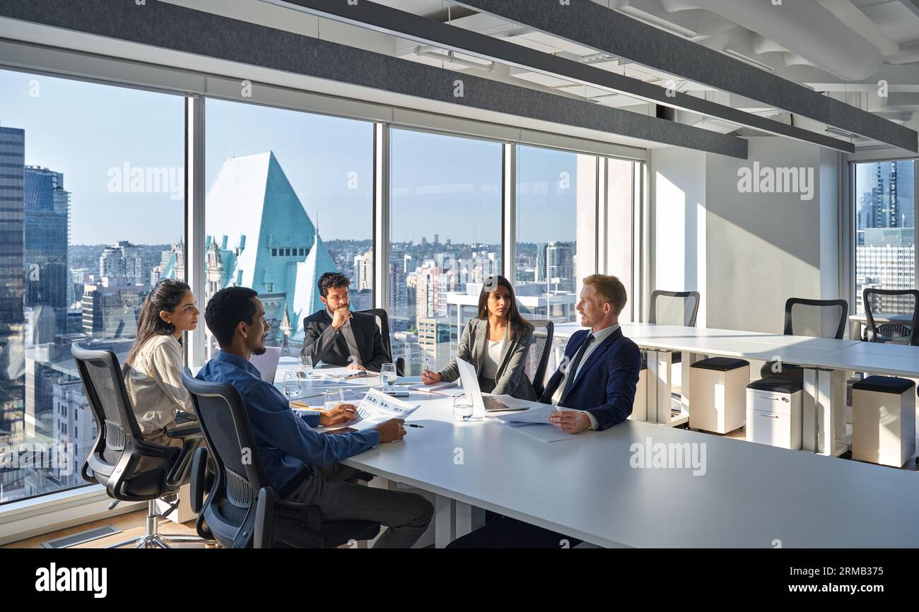 Busy diverse board executives team people working in meeting room Stock ...