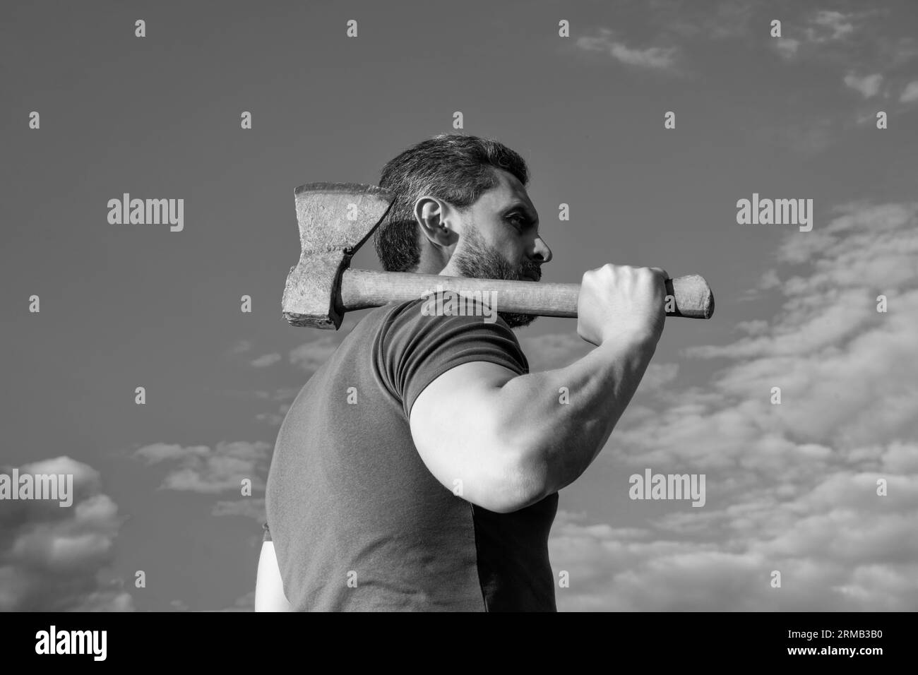 back view of man with axe. woodman man hold ax. brutal man on sky ...