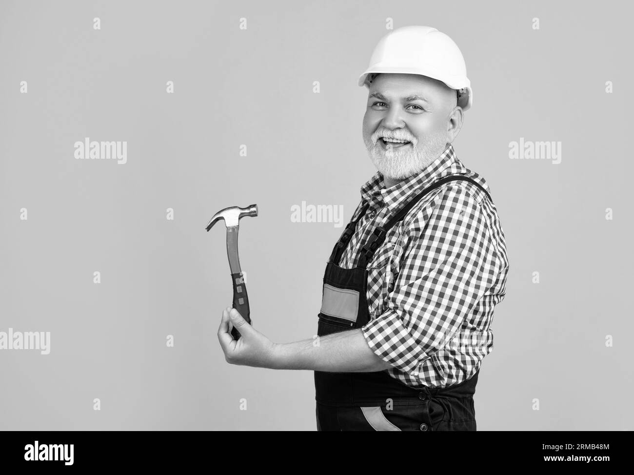 Yellow workman helmet Black and White Stock Photos & Images - Alamy