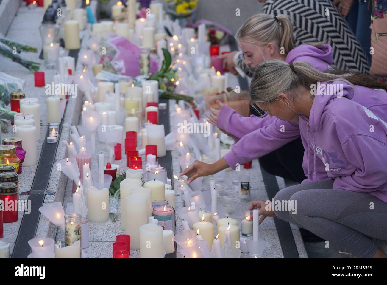 People light candles at the end of the vigil in Kickham Plaza, Co ...
