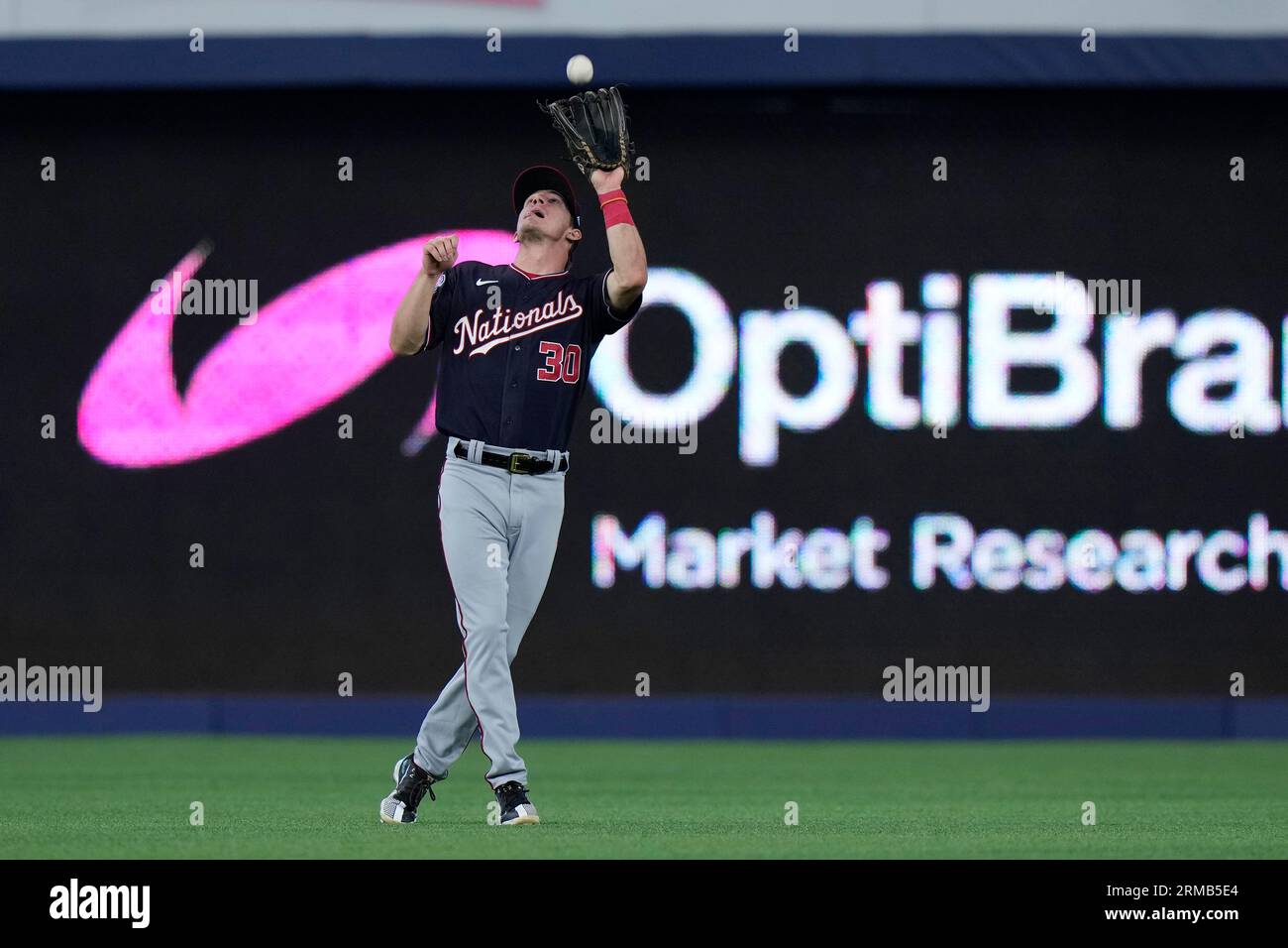 Washington Nationals center fielder Jacob Young catches a ball hit by ...