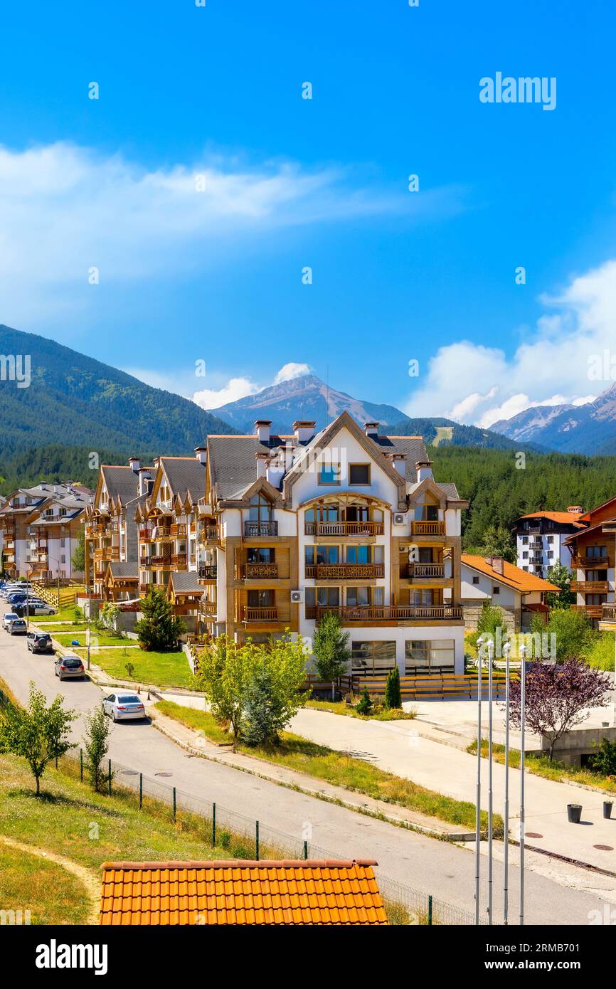 Bansko, Bulgaria summer street view with houses and Pirin peaks ...