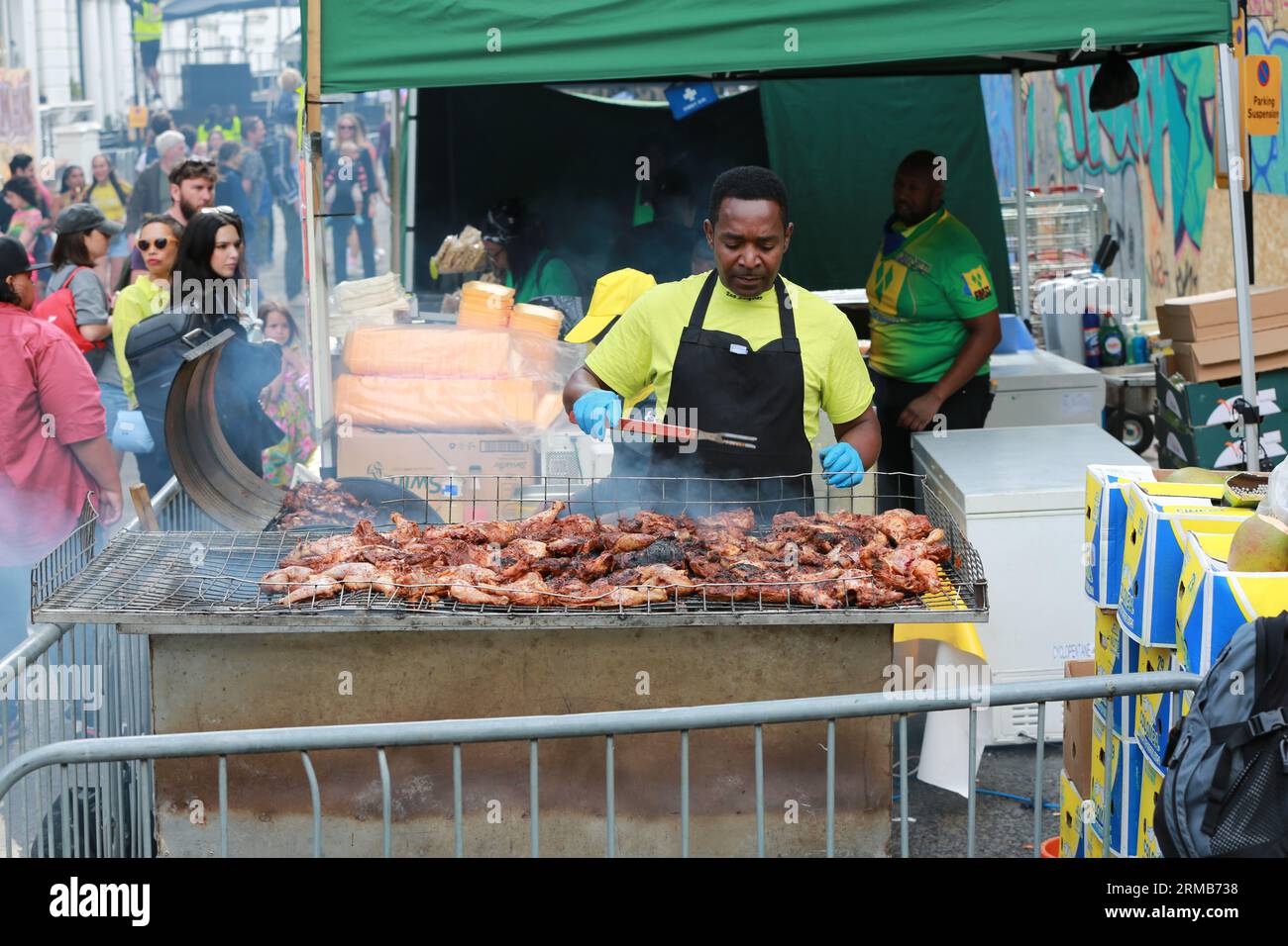 London, UK. 27 August 2023. Jerk Chicken smoked on a barbecue during ...
