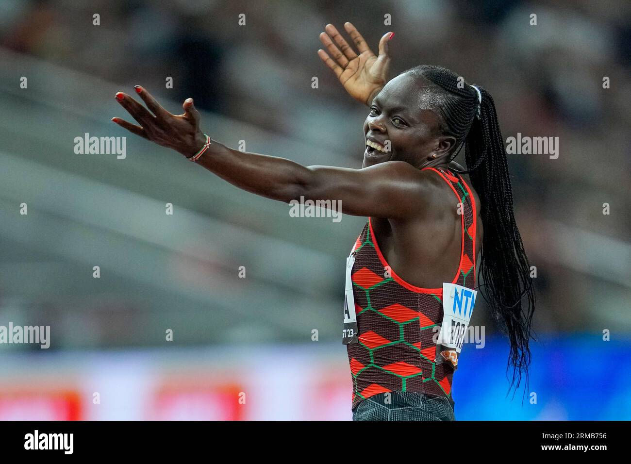 Mary Moraa, of Kenya, celebrates after winning the gold medal in the ...