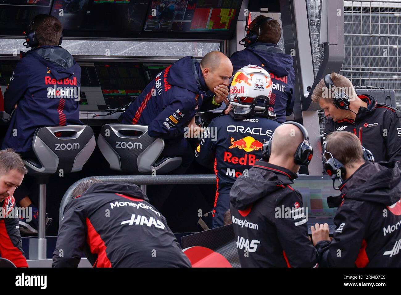 ZANDVOORT, NETHERLANDS - AUGUST 27: Max Verstappen of Oracle Red Bull Racing and his engineer ...