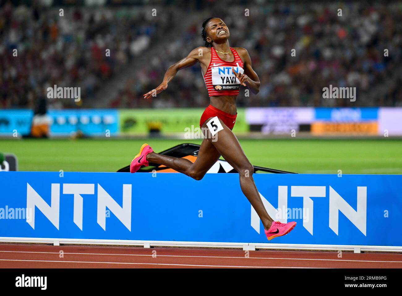 Winfred Mutile Yavi, of Bahrain celebrates after winning the gold medal ...