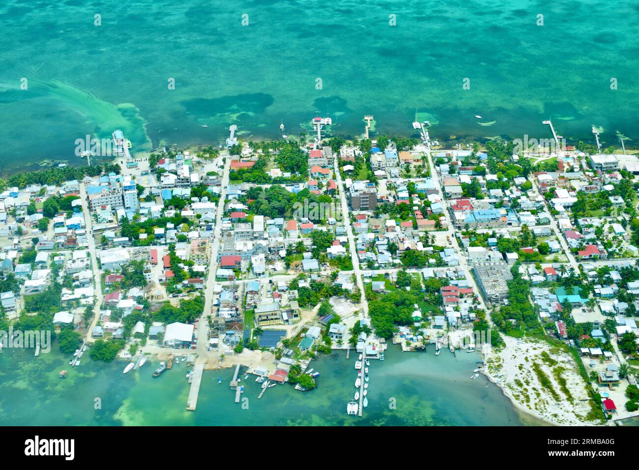 A view of Caye Caulker town as seen from a small plane flying over ...