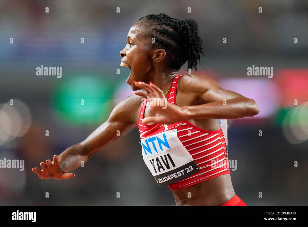 Winfred Mutile Yavi, of Bahrain celebrates after winning the gold medal ...