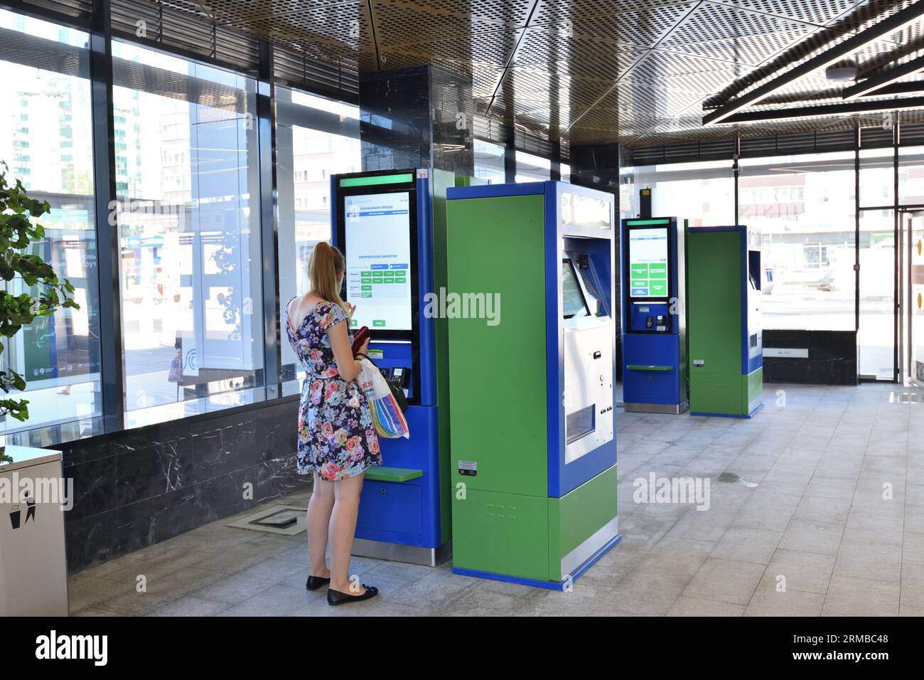 Moscow, Russia - Aug 21. 2023. Woman buying ticket through the terminal ...