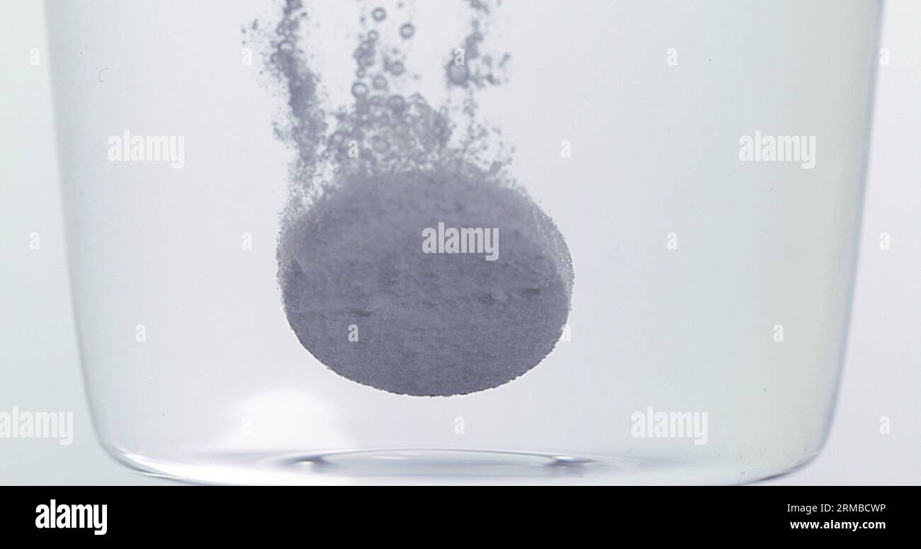 Tablets falling glass water against hi-res stock photography and images ...