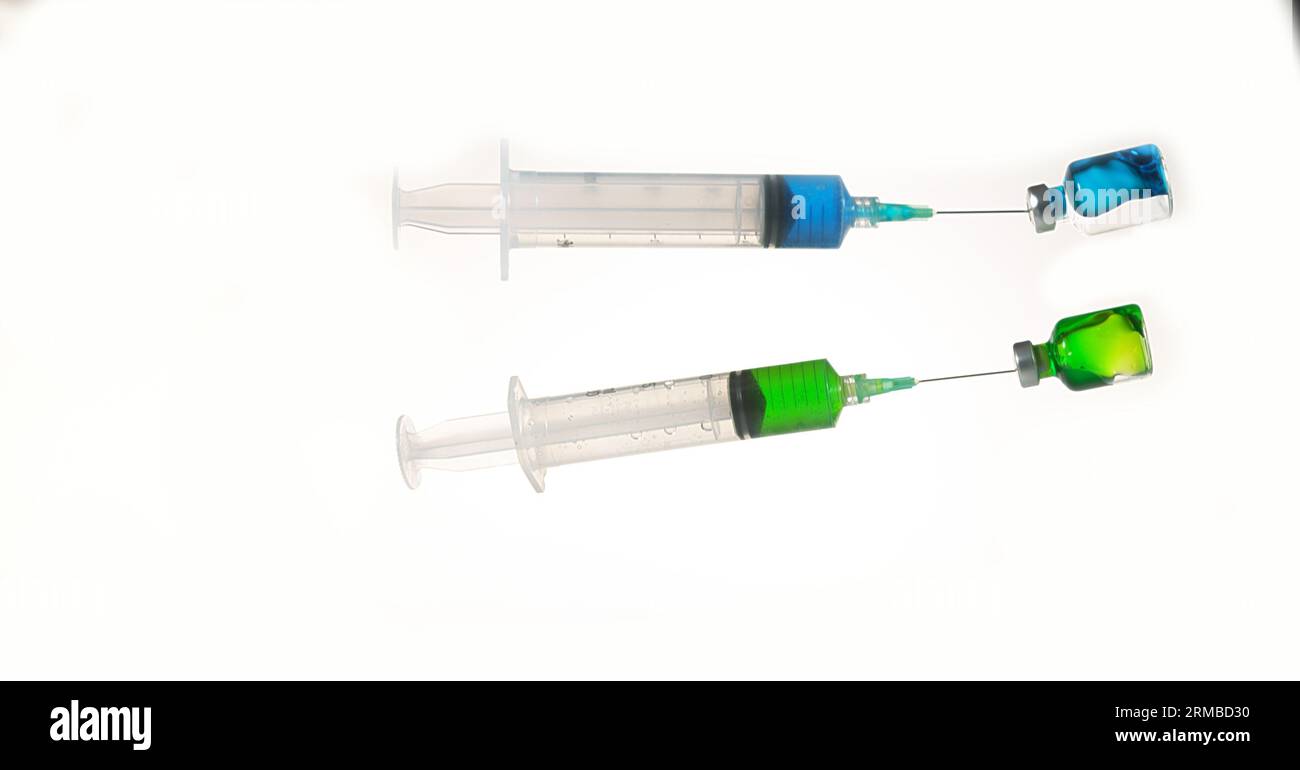 Syringe Falling against White Background Stock Photo - Alamy