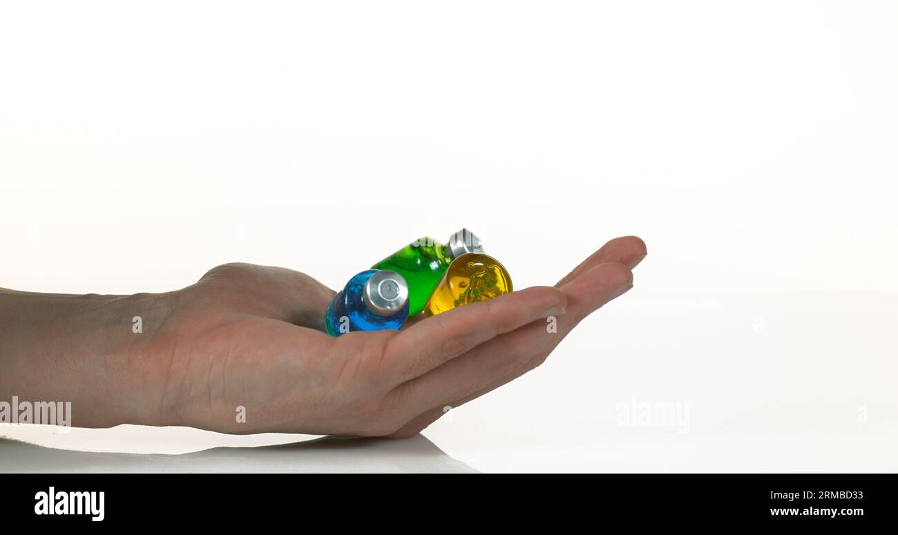 Medical Product Falling into Hand against White Background Stock Photo ...