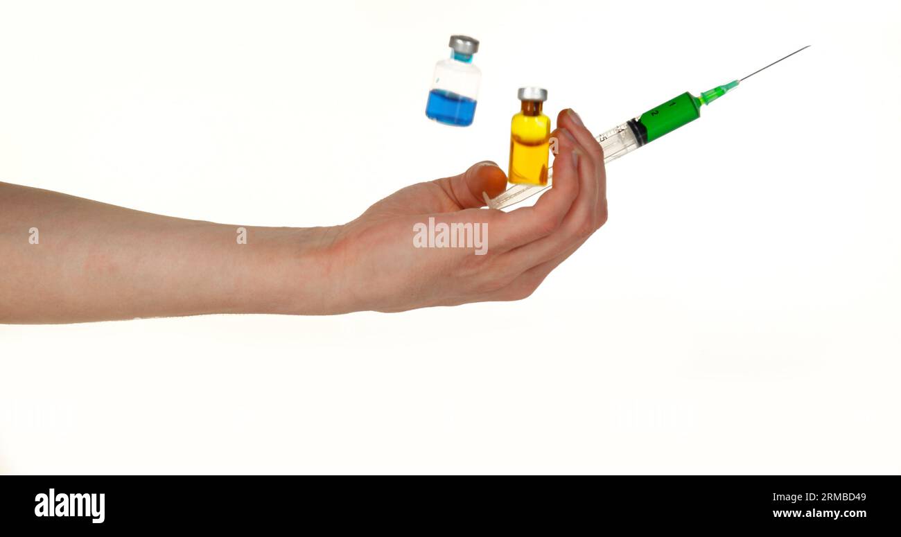 Medical Product Falling into Hand against White Background Stock Photo ...