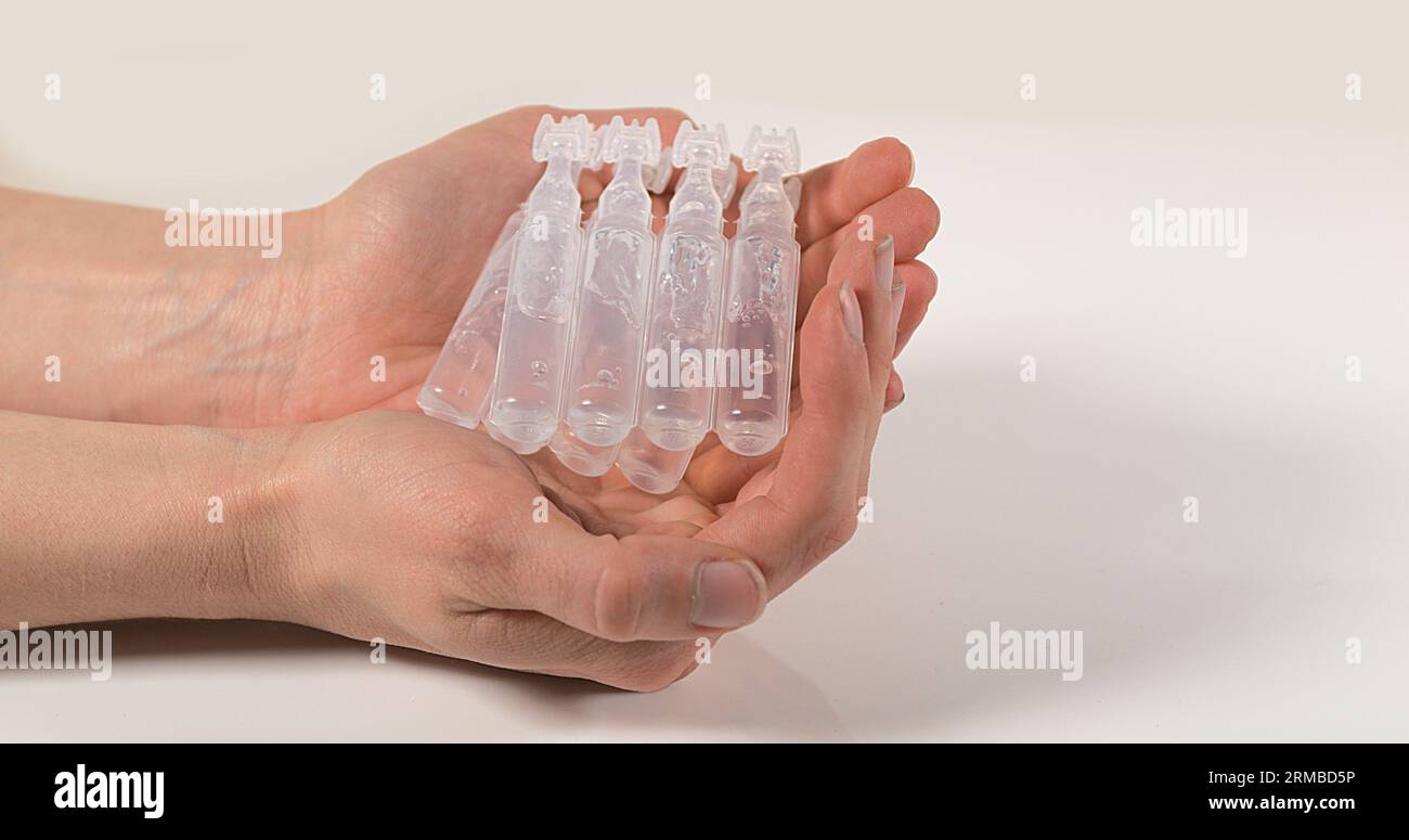Medical Product Falling into Hand against White Background Stock Photo ...
