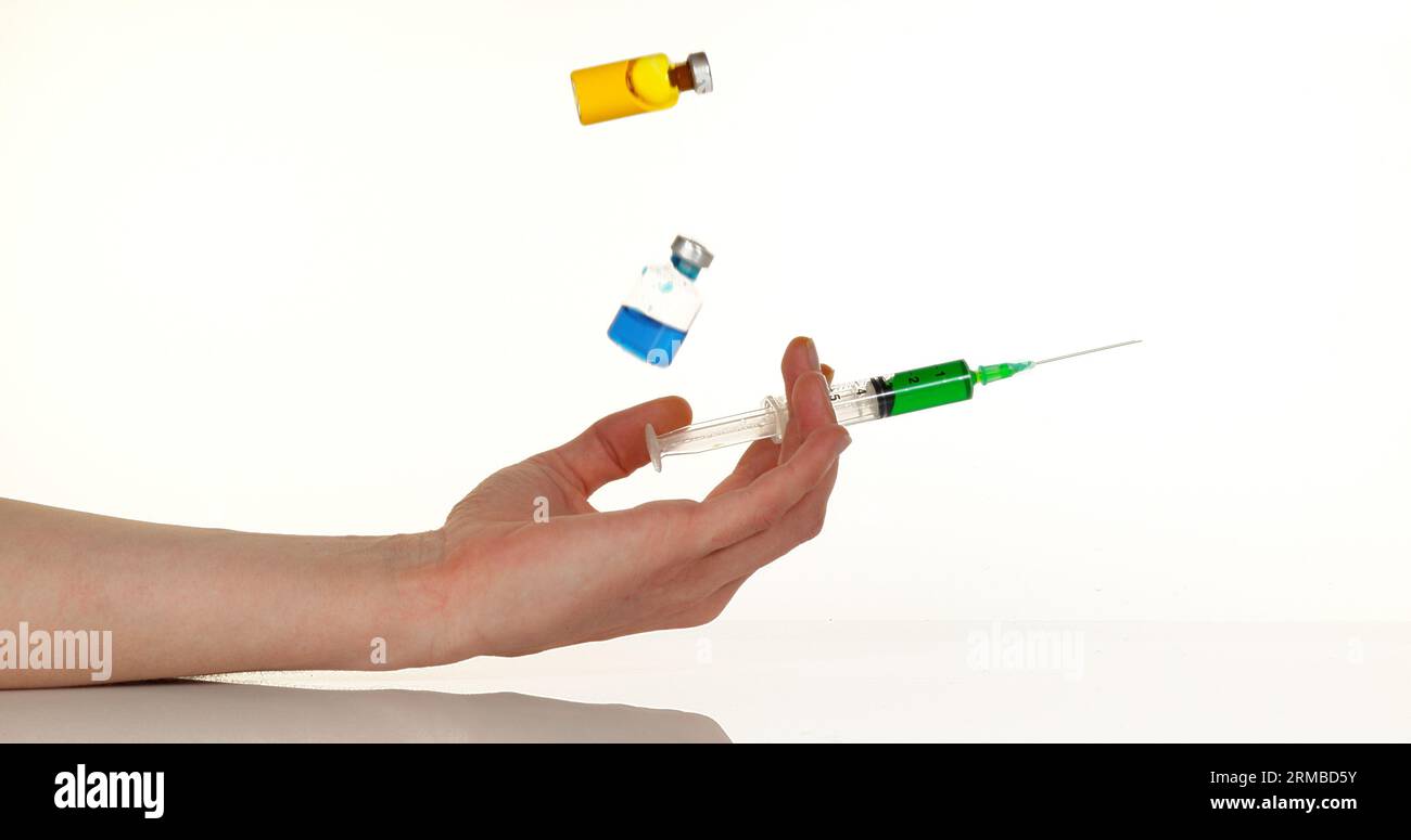 Medical Product Falling into Hand against White Background Stock Photo ...