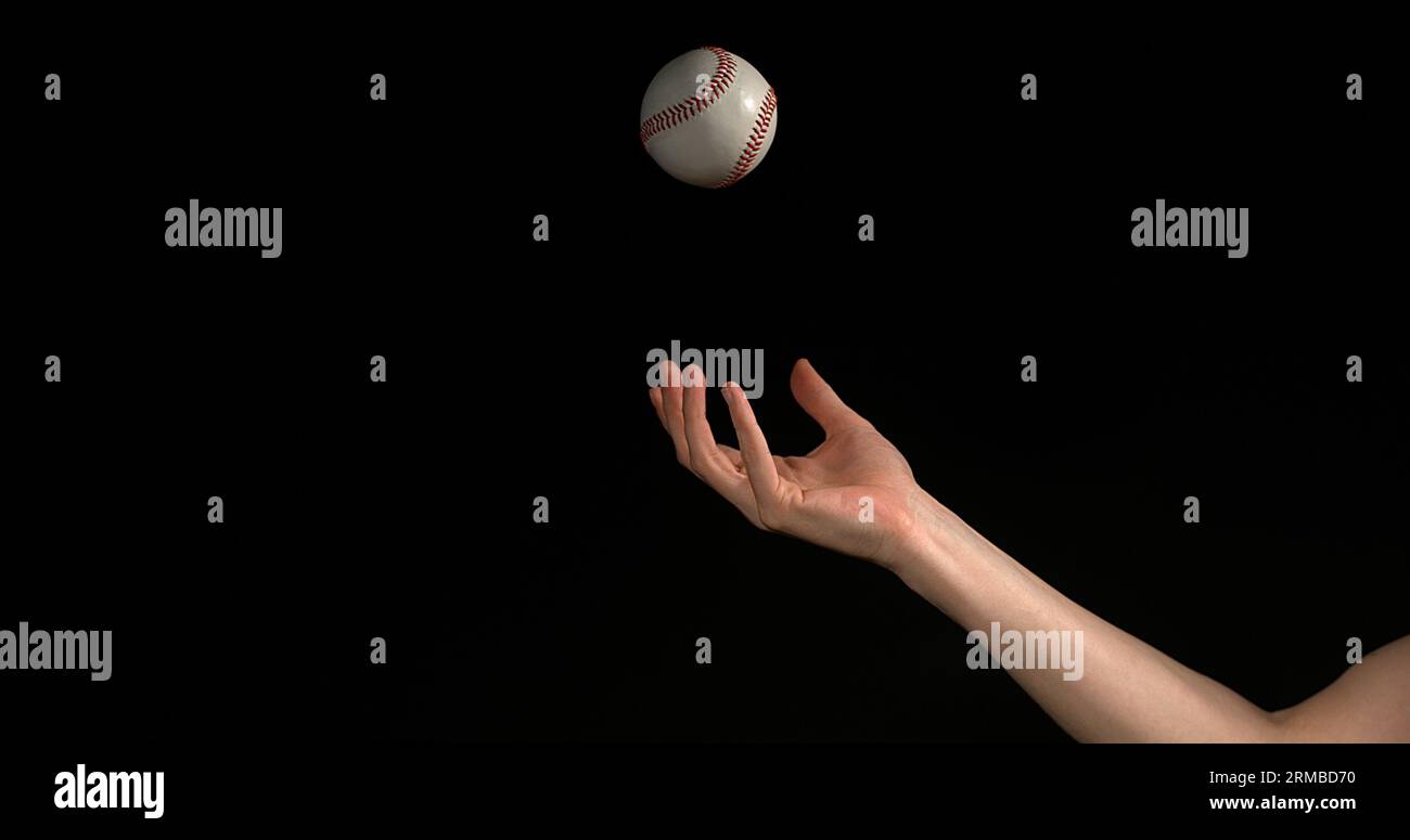 Hand of Woman Throwing a Ball of Baseball against Black Background ...