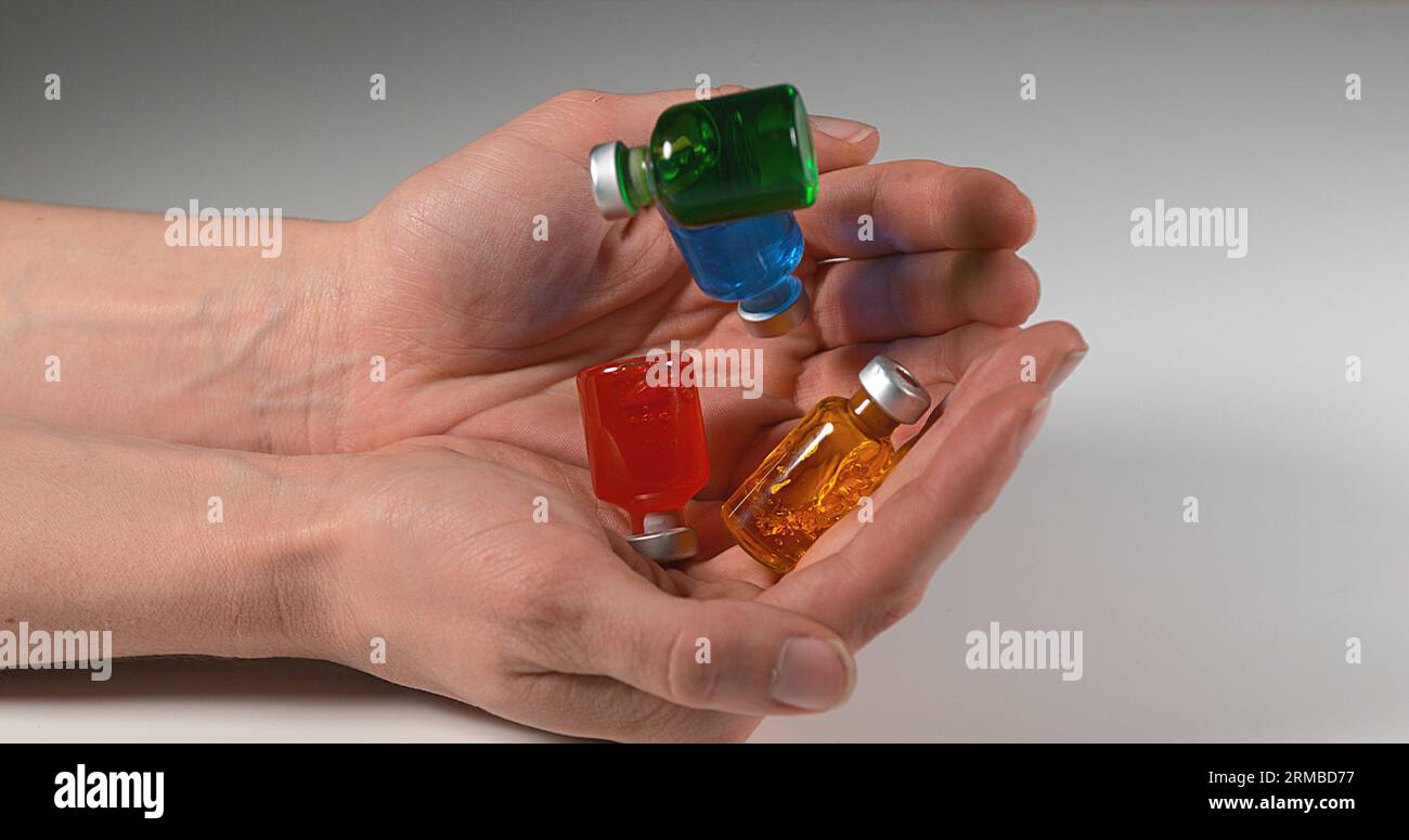 Medical Product Falling into Hand against White Background Stock Photo ...