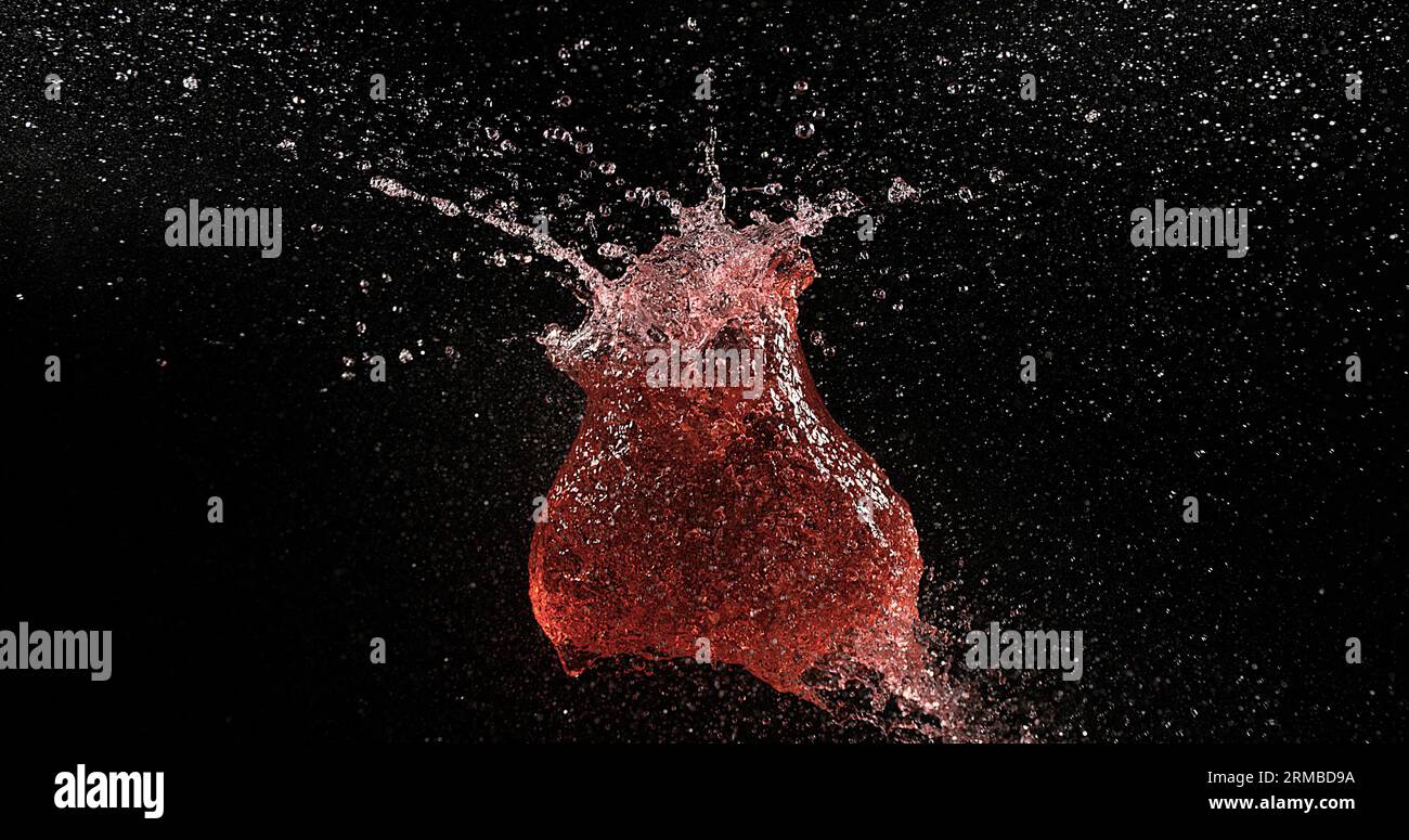 Shot Breaking Water Filled Red Balloon Stock Photo - Alamy