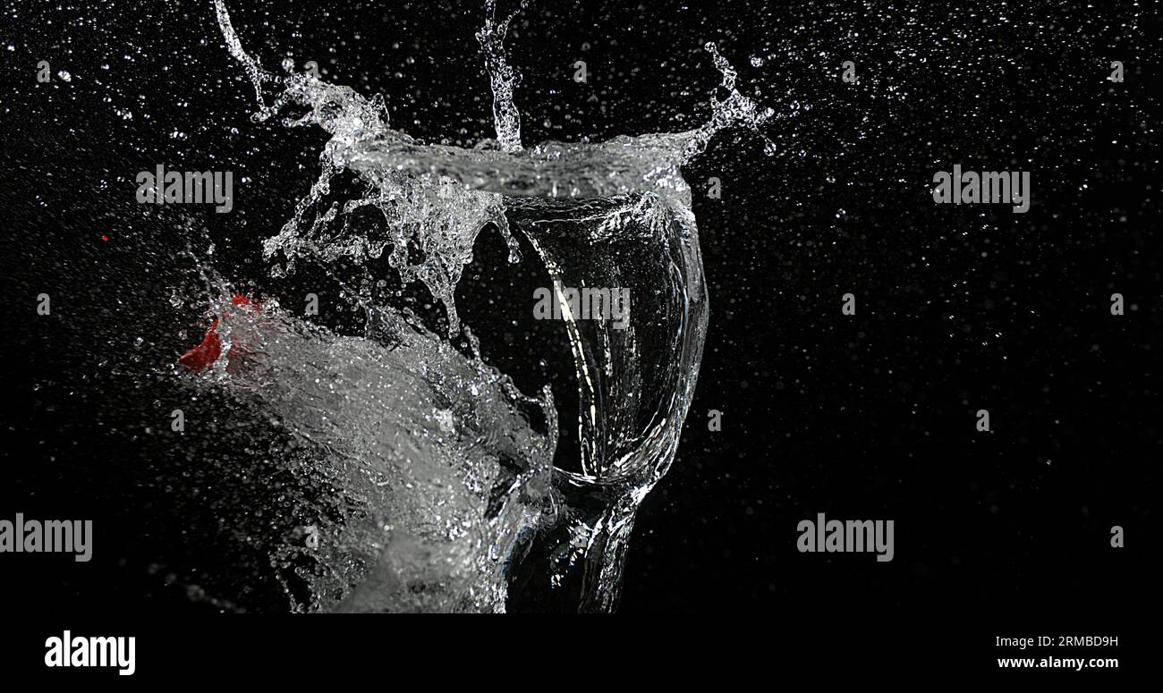 Shot Breaking Water Filled Red Balloon Stock Photo - Alamy