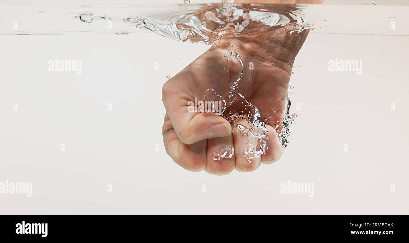 Hand entering water hi-res stock photography and images - Alamy