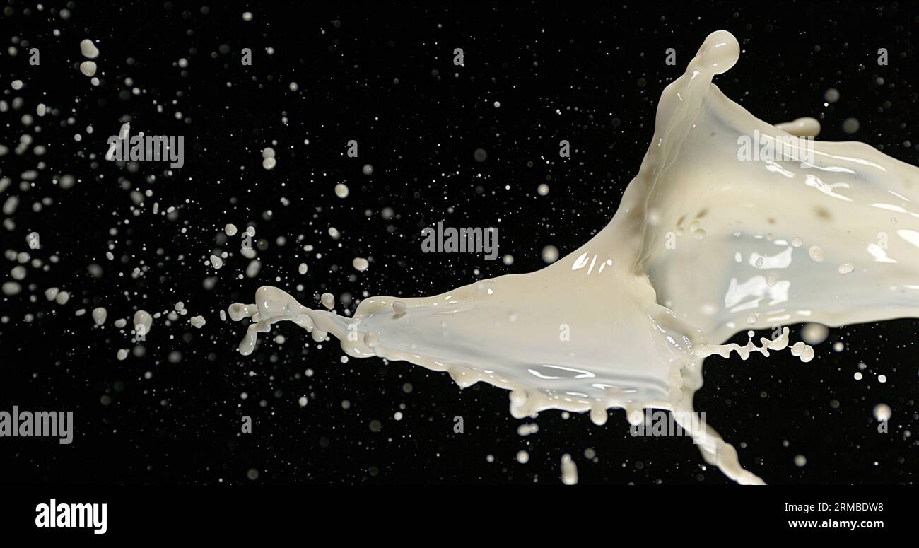 Exploding Milk against Black Background Stock Photo - Alamy