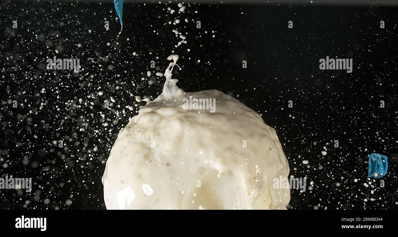 Shot Breaking Milk Filled Balloon Stock Photo - Alamy