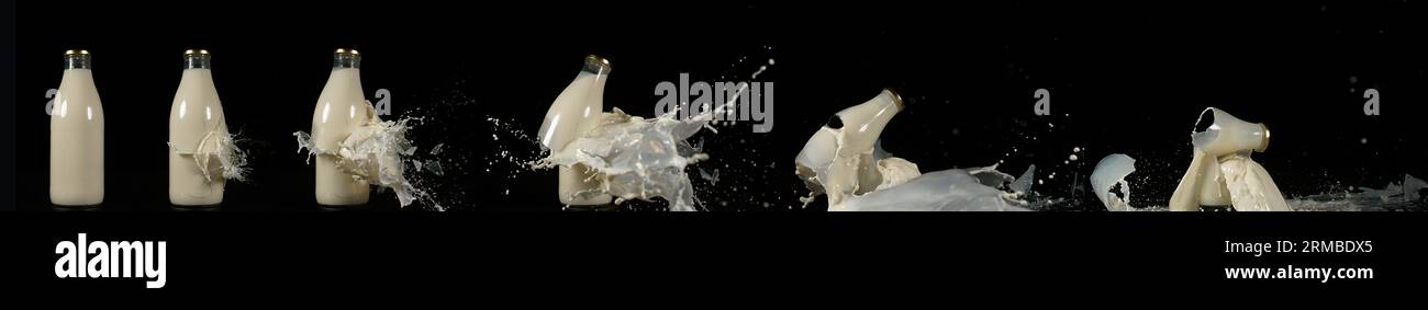 Bottle of Milk Exploding against Black Background Stock Photo - Alamy