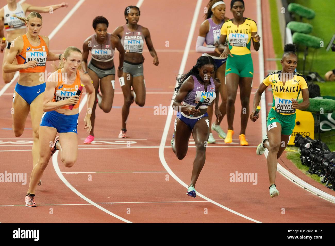 Athletes compete the final of the Women's 4x400-meters relay during the ...