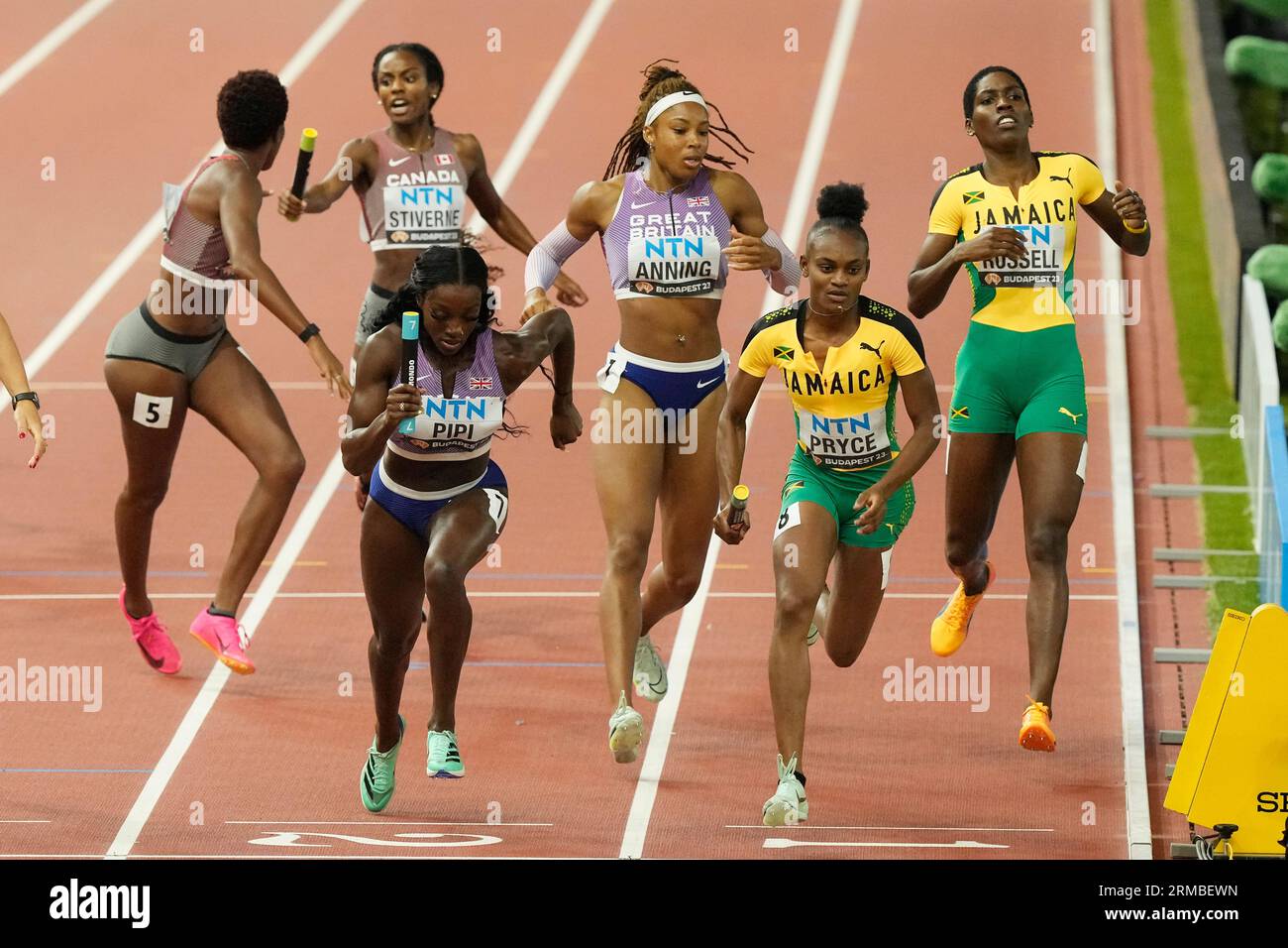 Athletes compete the final of the Women's 4x400-meters relay during the ...
