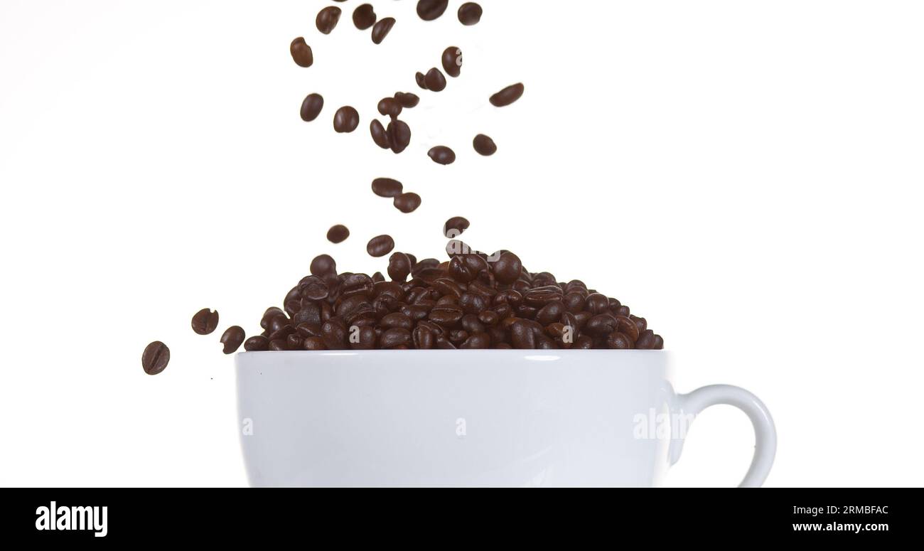 Coffee beans falling against white hi-res stock photography and images ...
