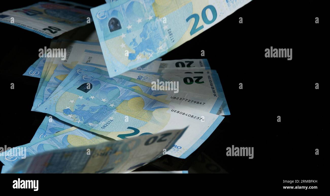 Euros Money Falling against Black Background Stock Photo - Alamy