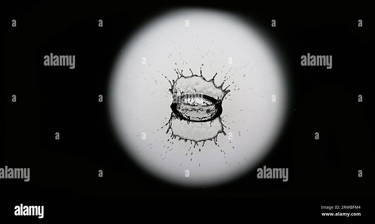 Drop of Water falling into Water, Full Moon Stock Photo - Alamy
